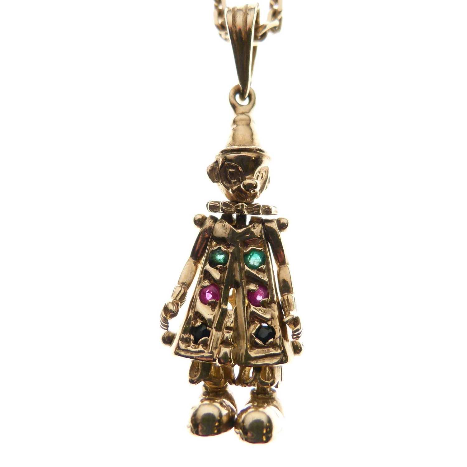 Lot 43 - Yellow metal articulated Pierrot pendant with