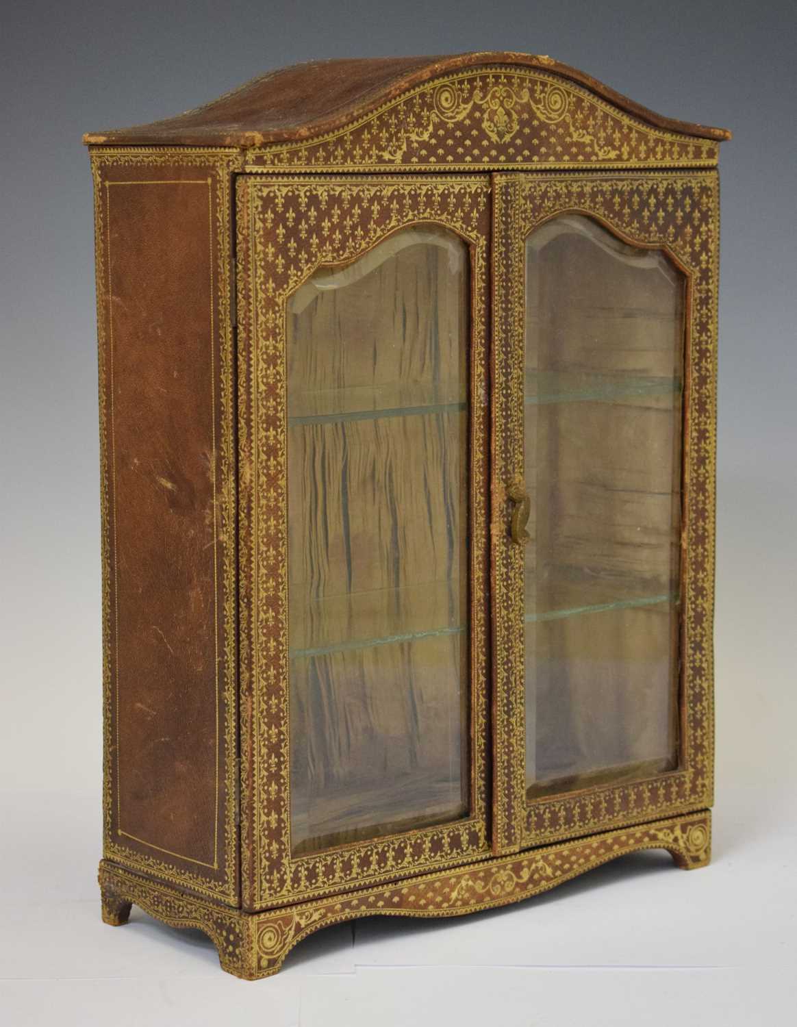 Lot 362 - Early 20th century gilt leather glazed table