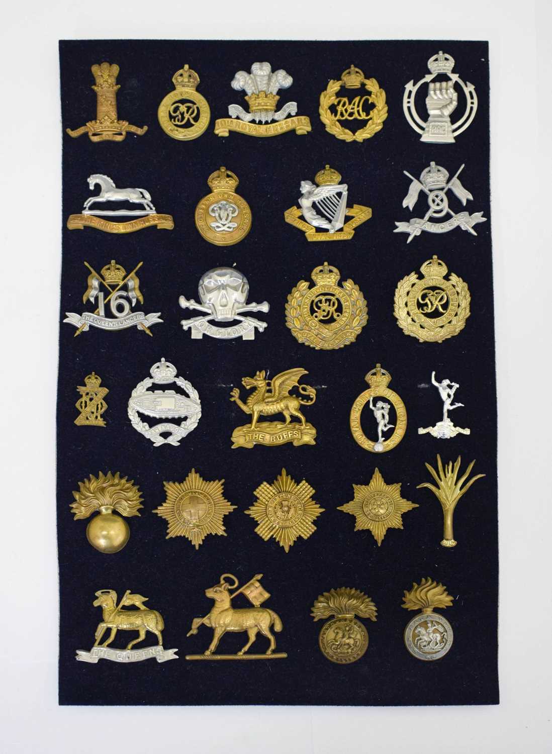Lot 332 - Mixed group of cap badges, and reference
